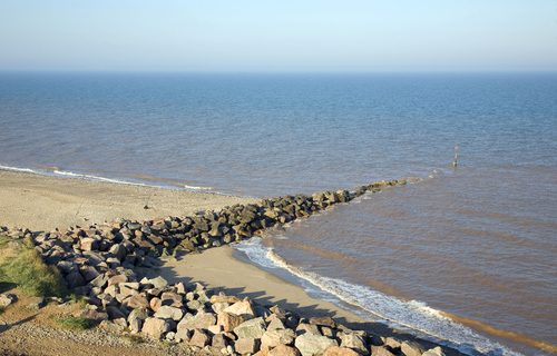 Longshore drift and Rock armour groyne on the Holderness coast at ...